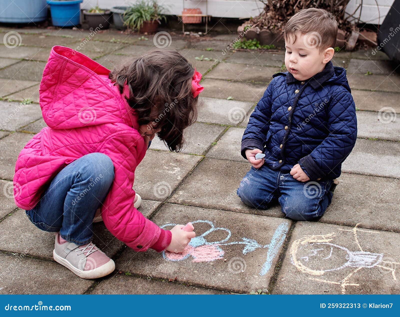 Siblings are Drawing on the Ground in the Backyard Stock Image - Image ...
