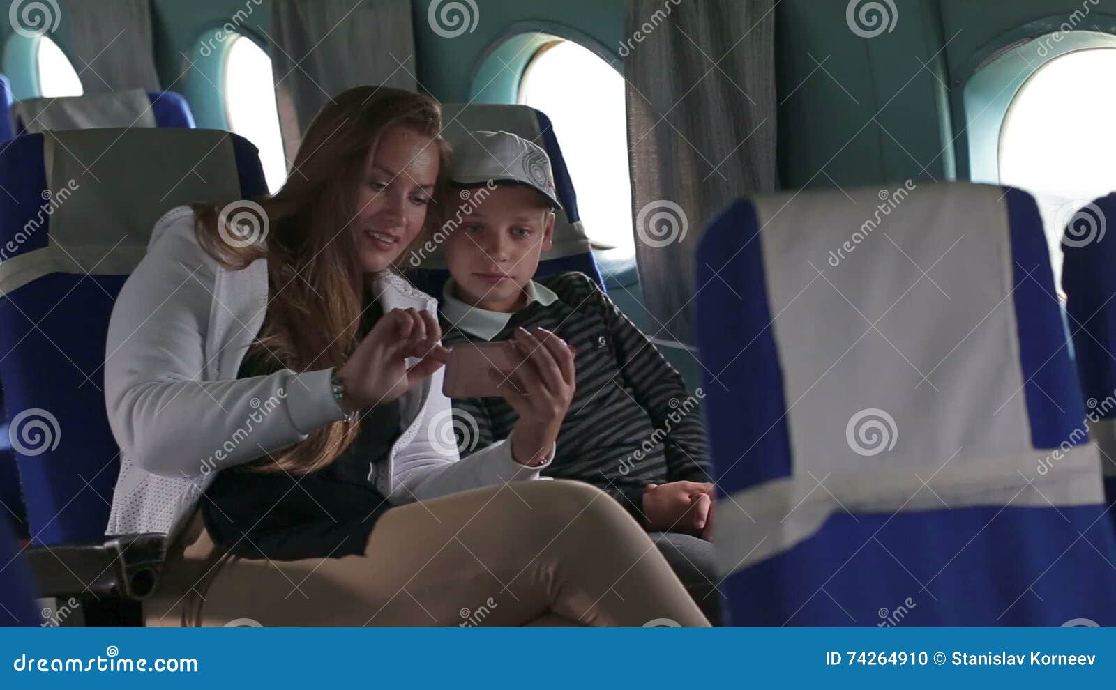 Brother and Sister are Flying in an Airplane Stock Footage - Video of ...