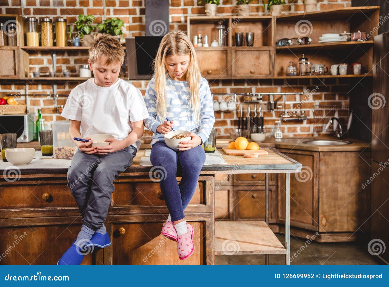 Brother and Sister Have Breakfast Sitting on the Table Stock Photo - Image of brother, childhood ...