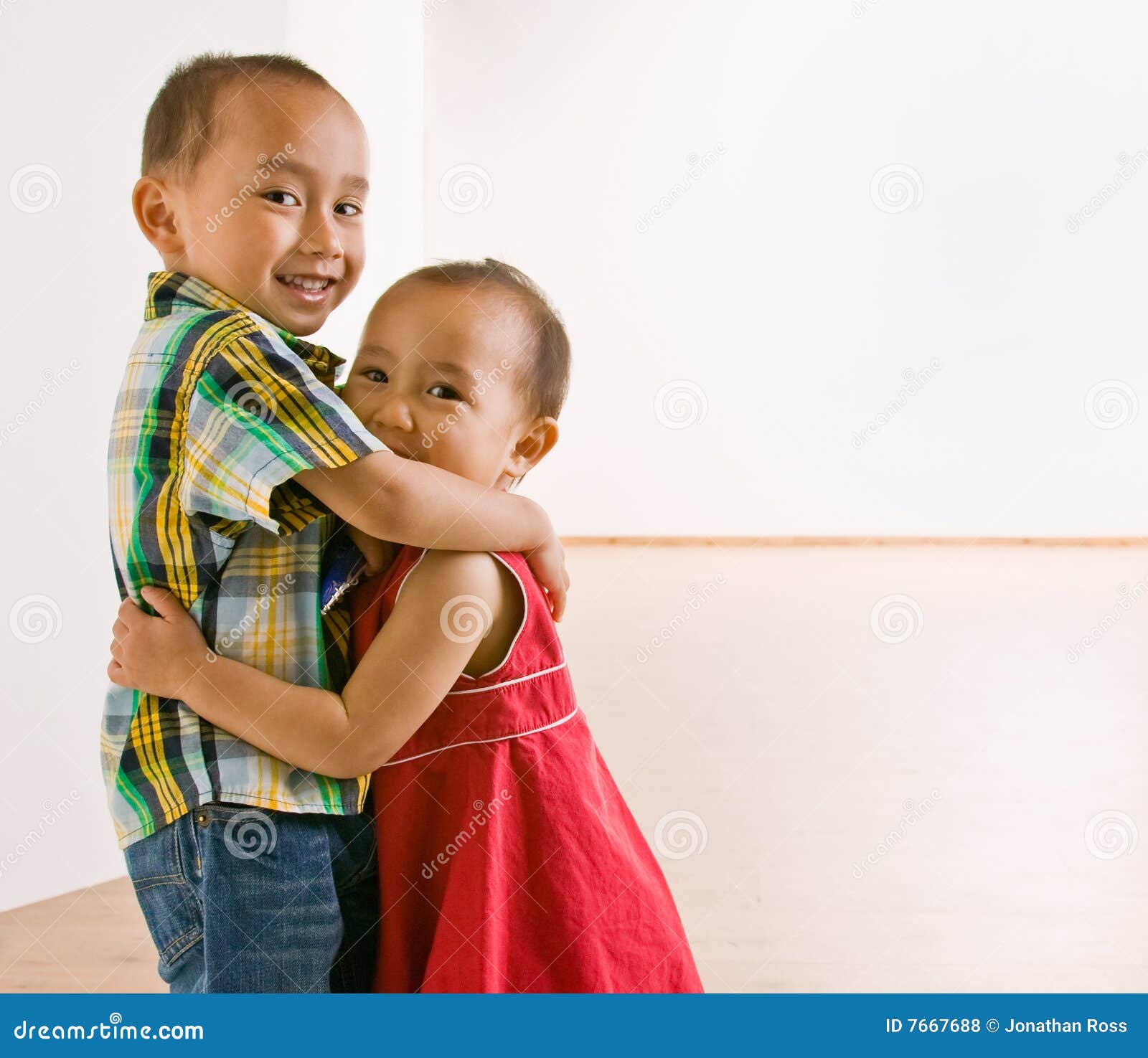 Brother and sister hugging stock photo. Image of asian - 7667688