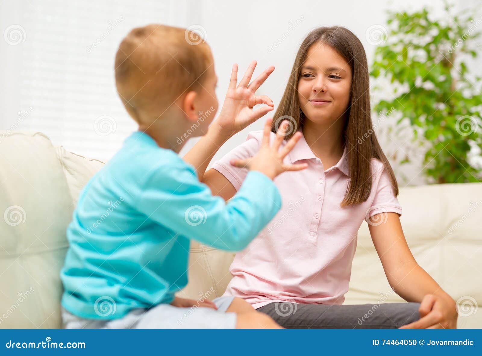 Brother and Sister Learn Sign Language Stock Photo - Image of brother ...