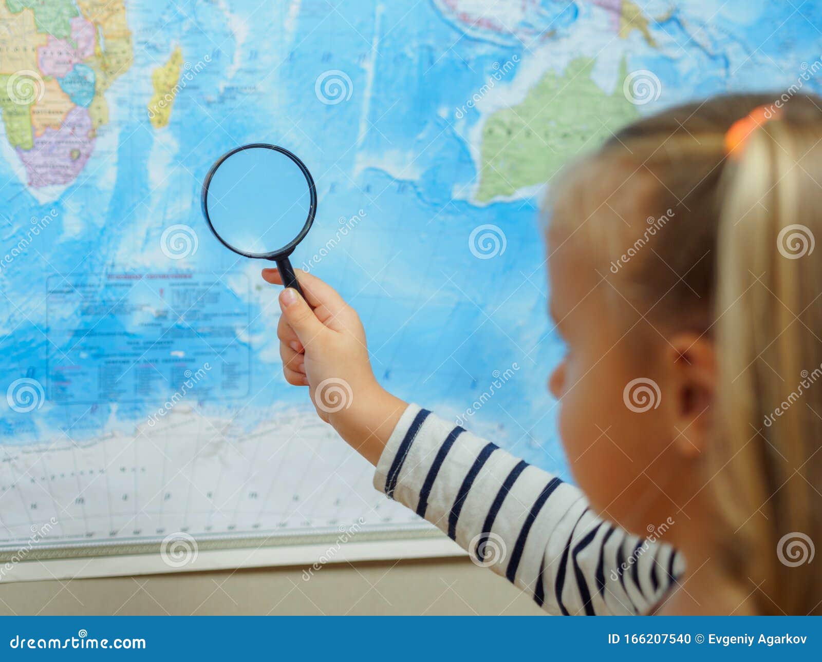 Brother and Sister Learning a Map through a Magnifying Glass, Slow ...