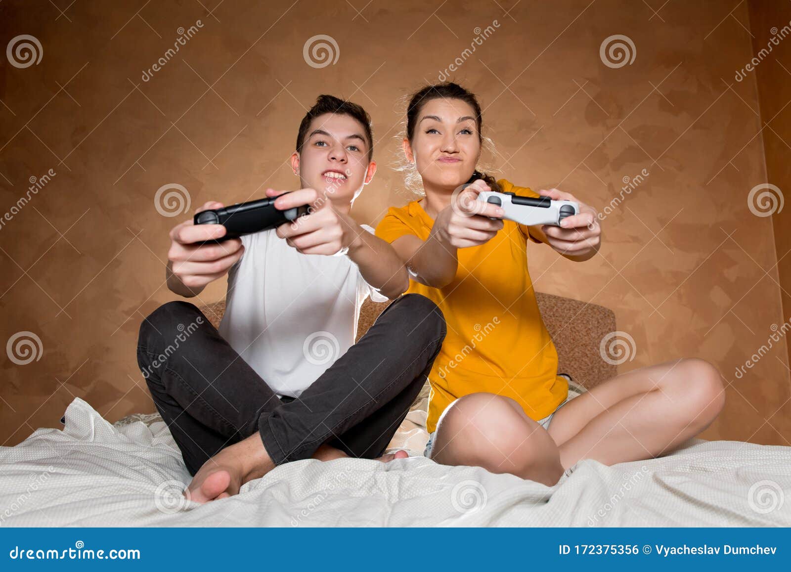 Brother and Sister are Passionately Playing a Computer Game Stock Photo ...
