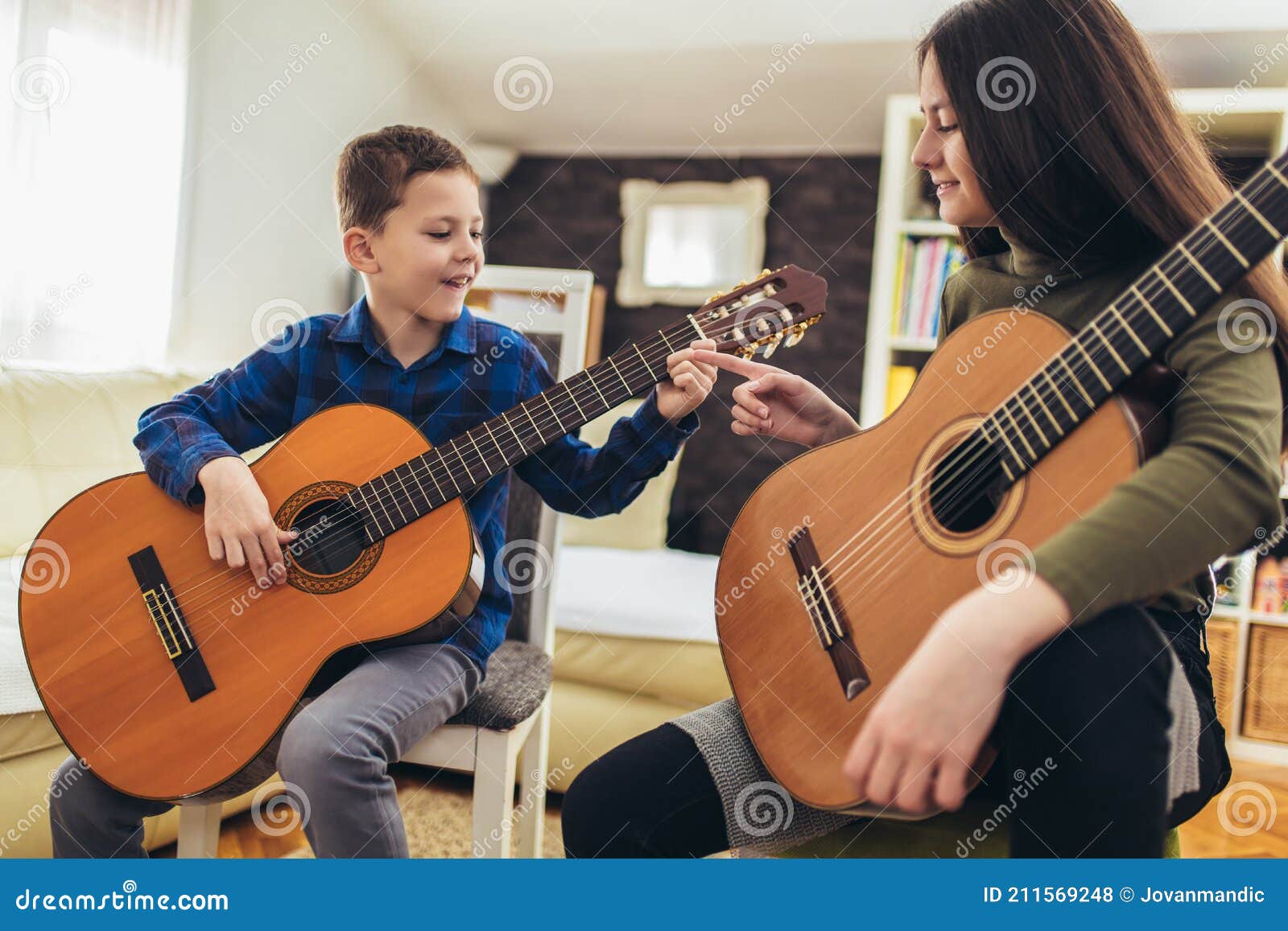 Brother and Sister Playing Guitar and Having Fun Stock Photo - Image of ...