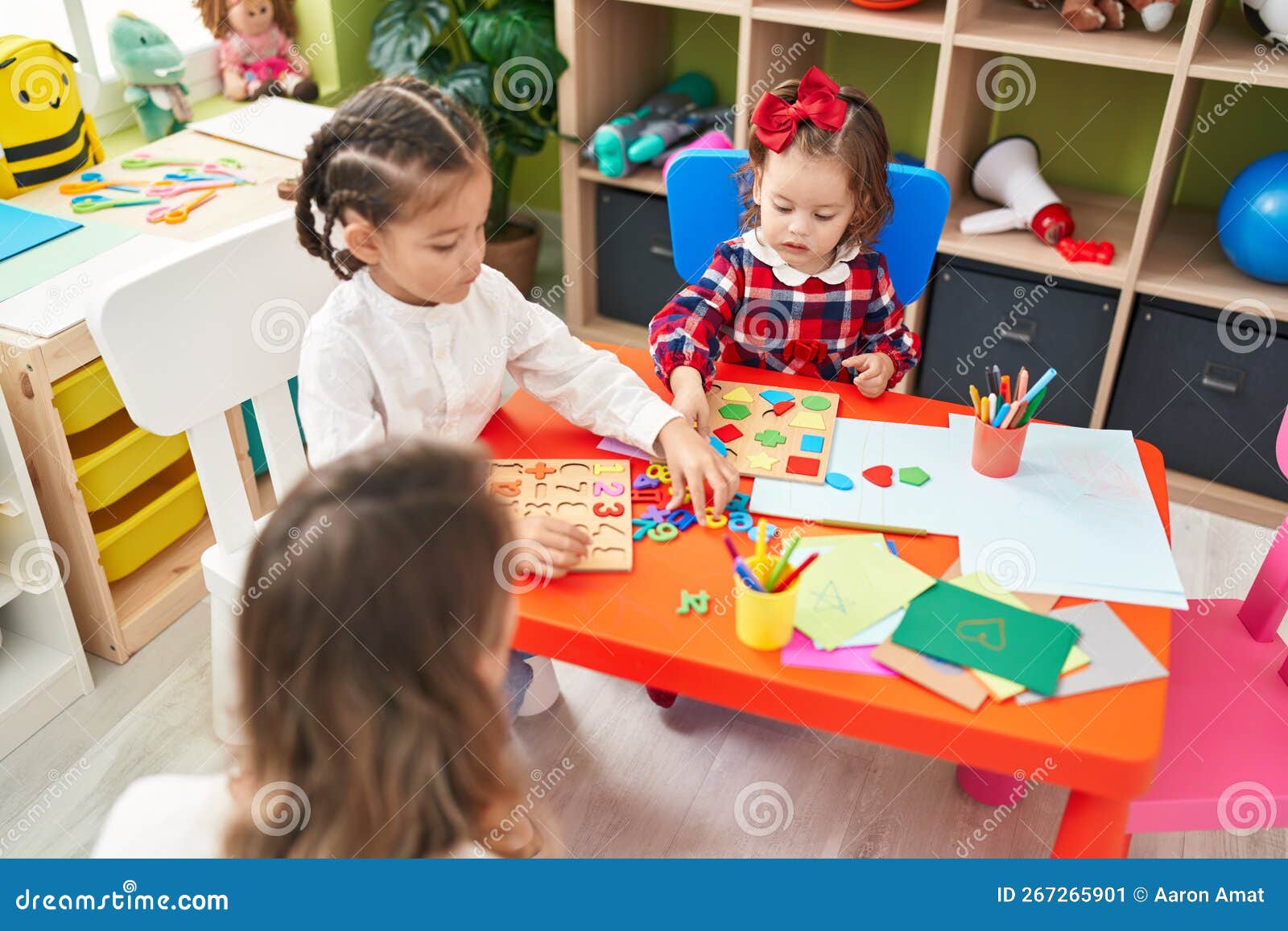 Brother and Sister Playing with Maths Puzzle Game Sitting on Table at ...