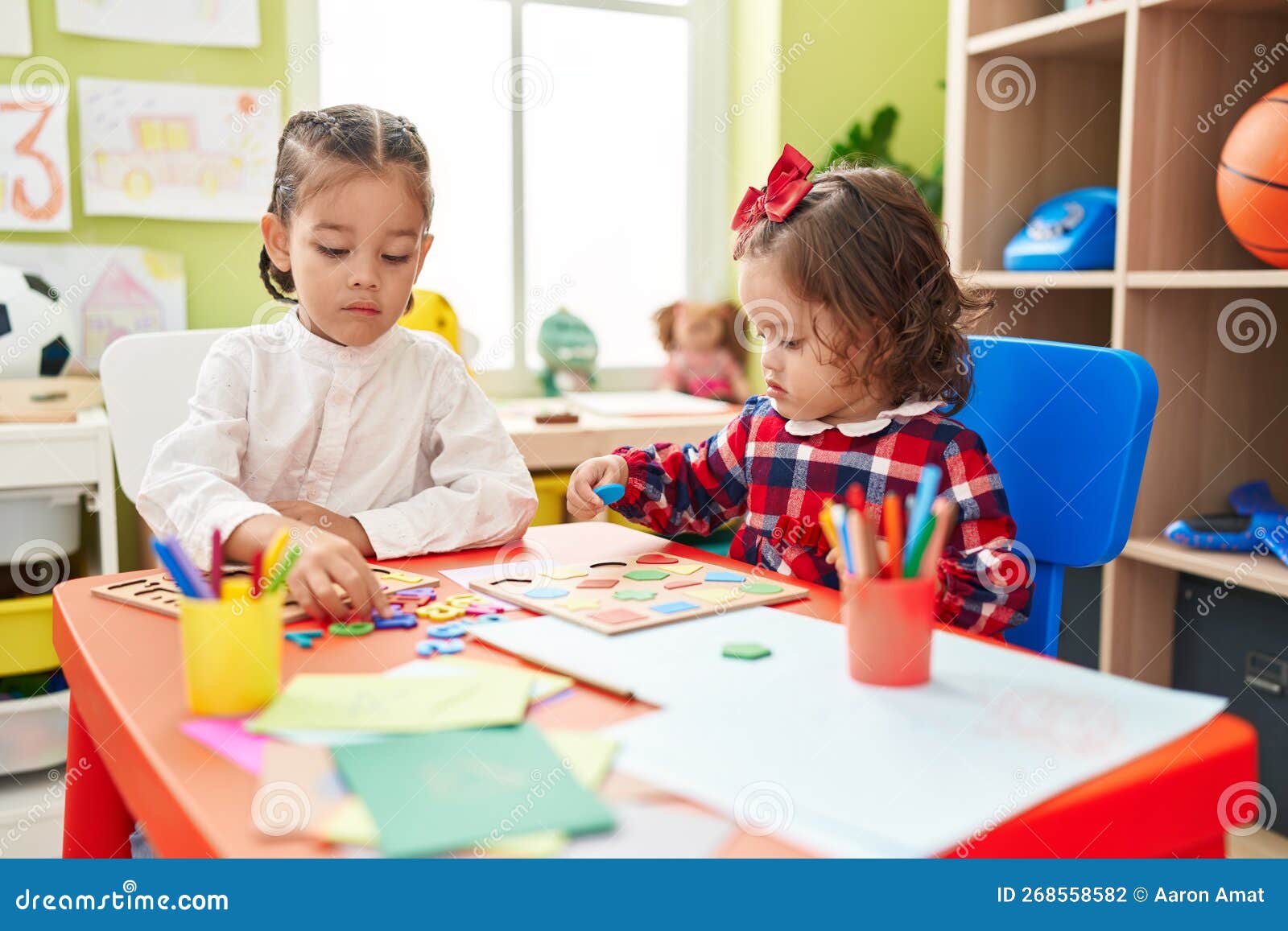 Brother and Sister Playing with Maths Puzzle Game Sitting on Table at ...