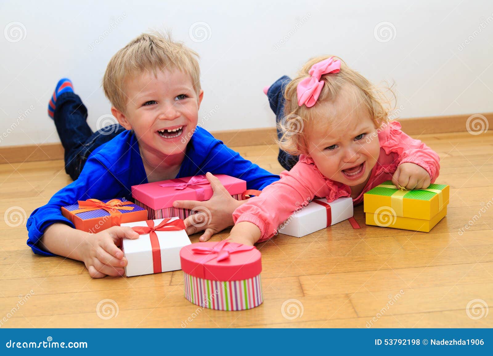 Brother and Sister Rivalry, Sorting Presents Stock Photo - Image of ...