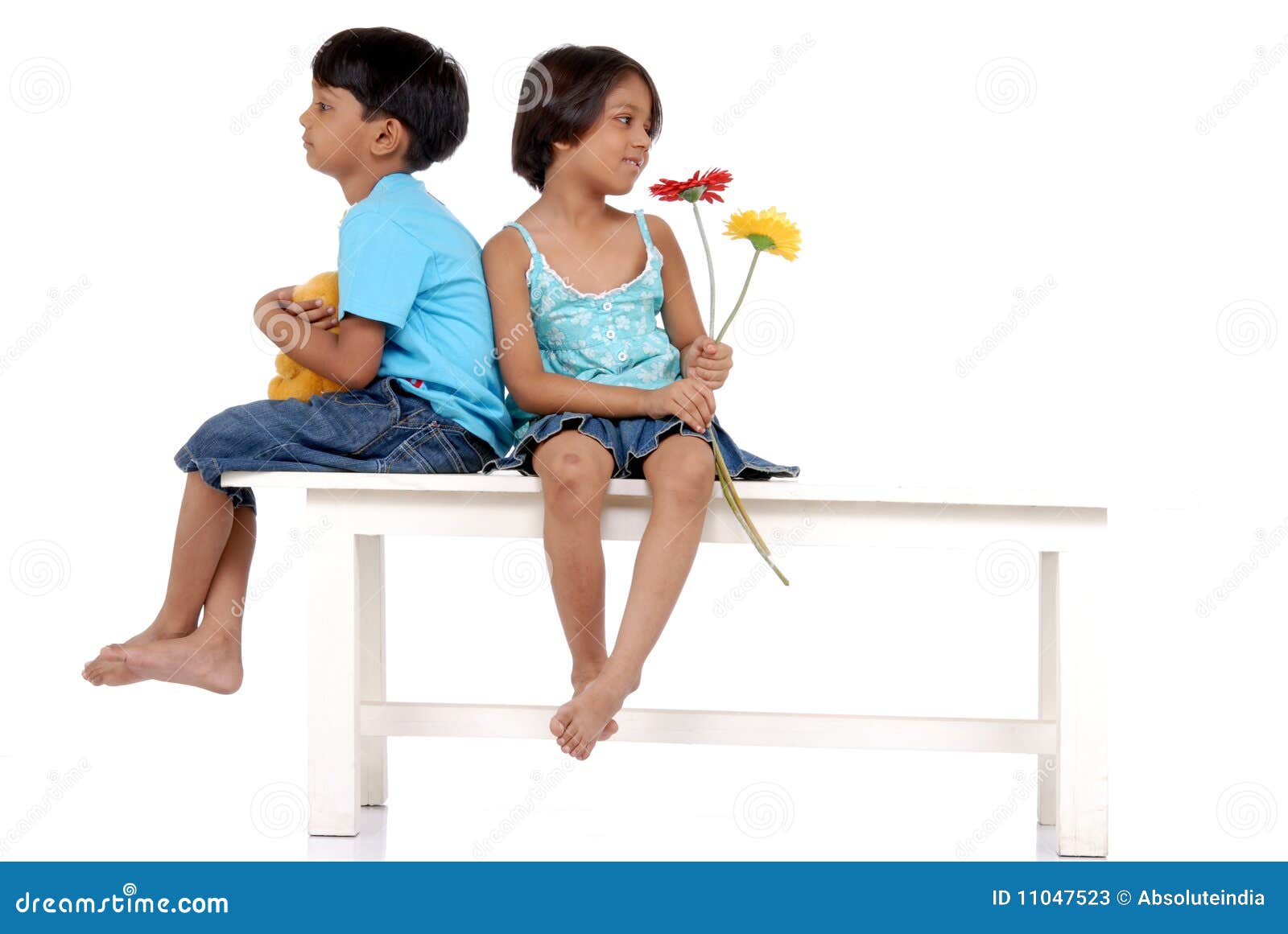 Brother and Sister Sitting on Bench Stock Image - Image of blue ...