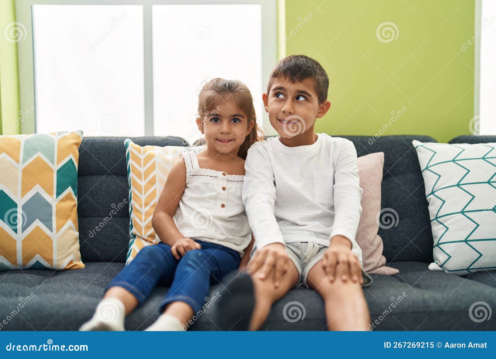 Brother and Sister Smiling Confident Sitting on Sofa at Home Stock ...