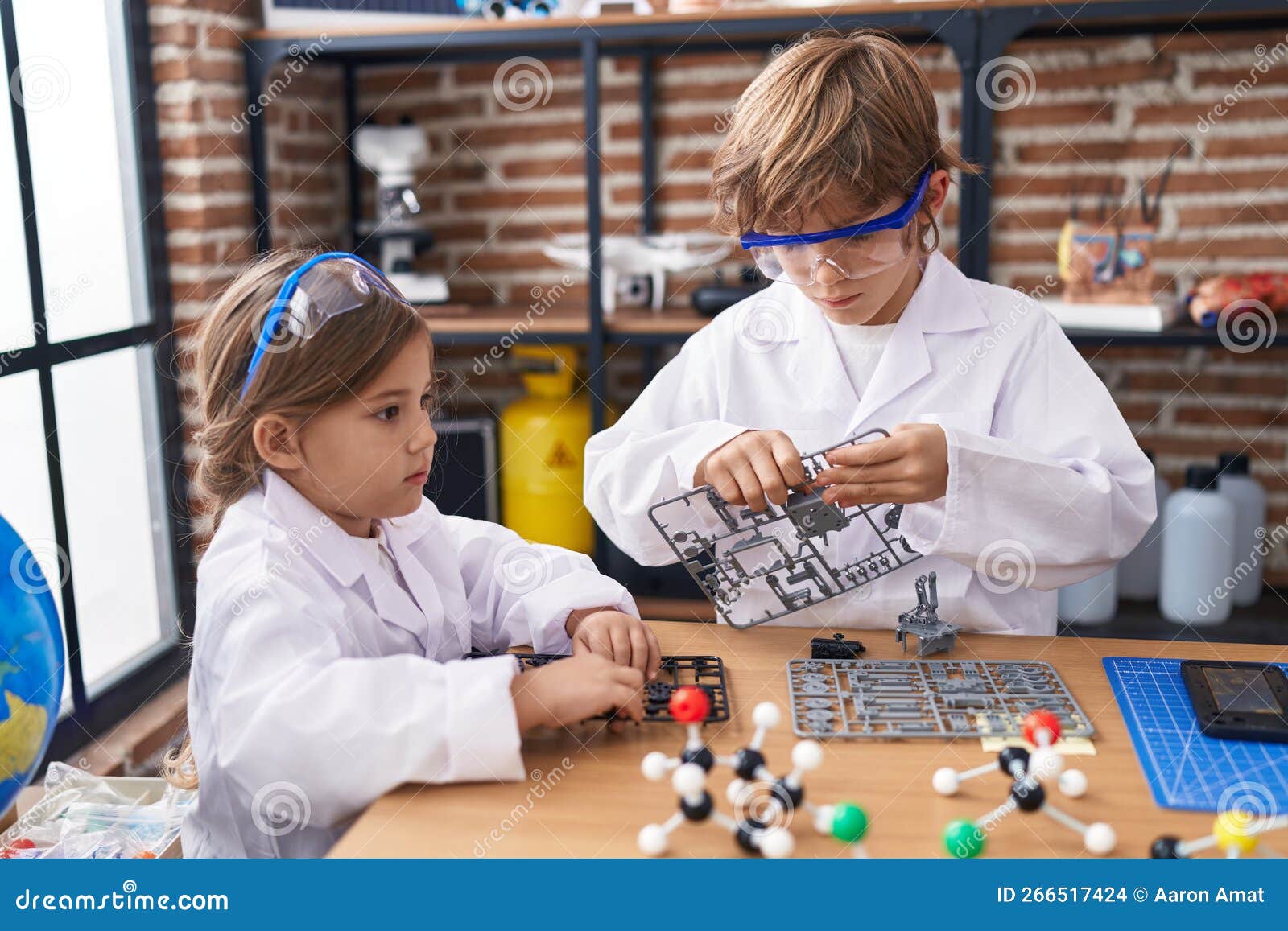 Brother and Sister Students Doing Experiment at Laboratory Classroom ...