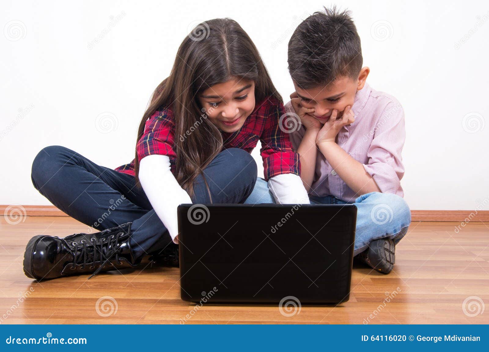 Brother and Sister Using Laptop Stock Photo - Image of elegant, happy ...
