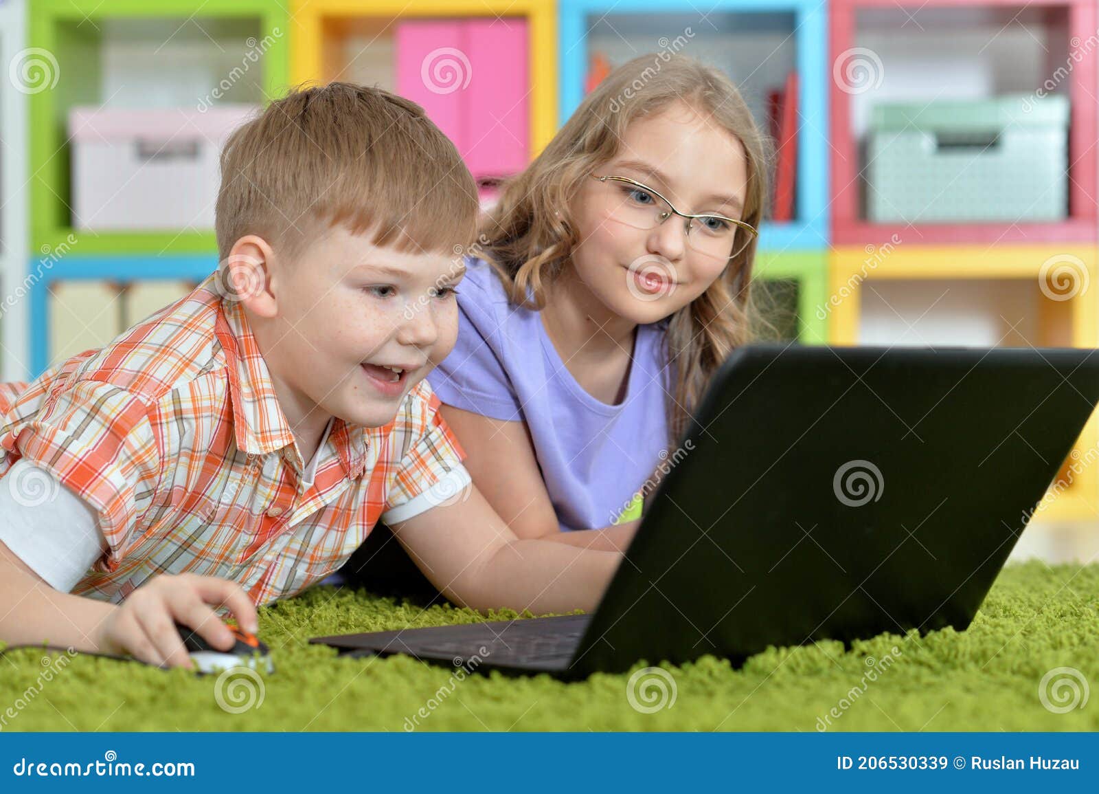 Brother and Sister Using Laptop at Home Stock Image - Image of ...