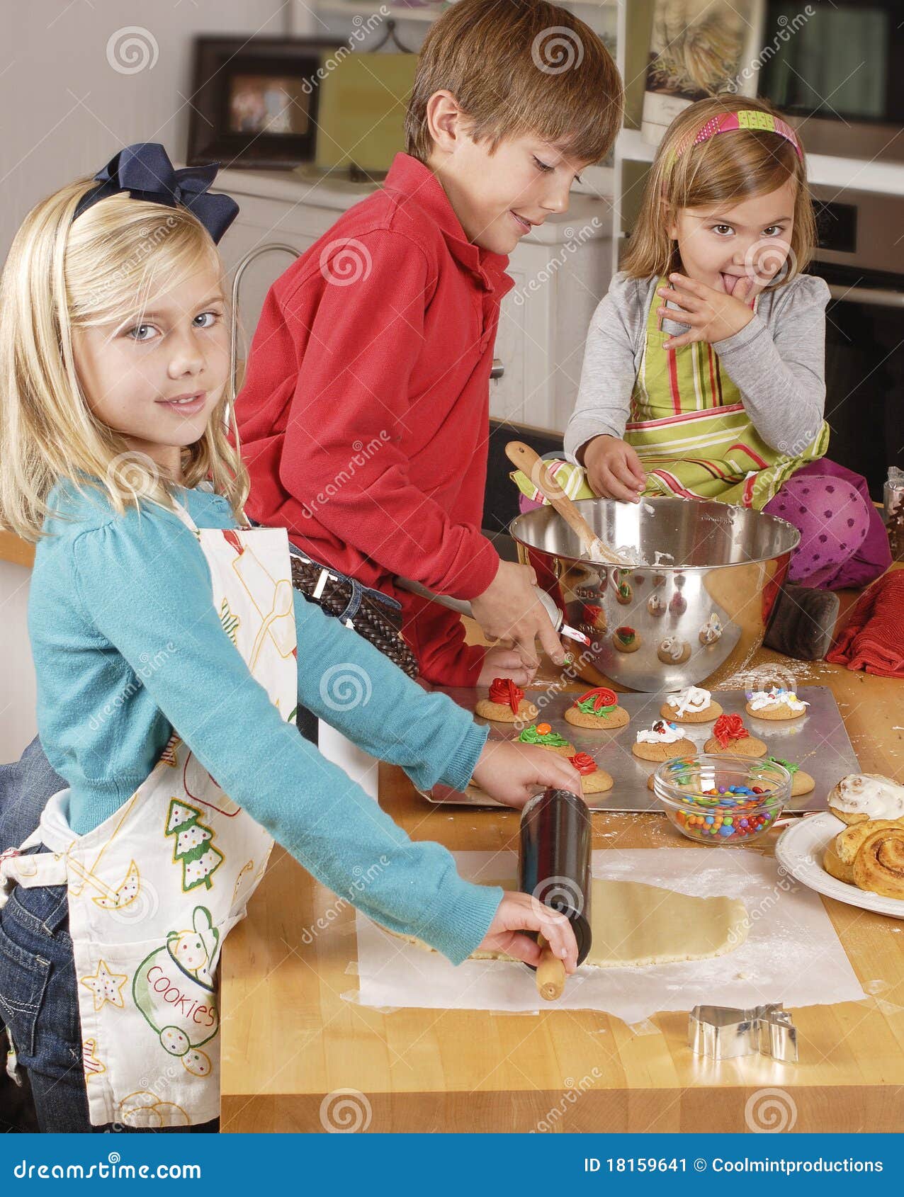 Brother and Sisters Cooking Stock Image - Image of caucasian, buns ...