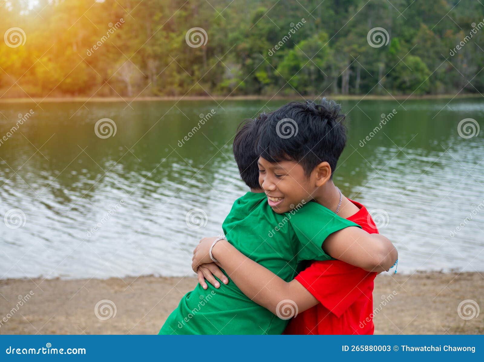 Brothers Hug Each Other by the Reservoir in the Evening Stock Image ...