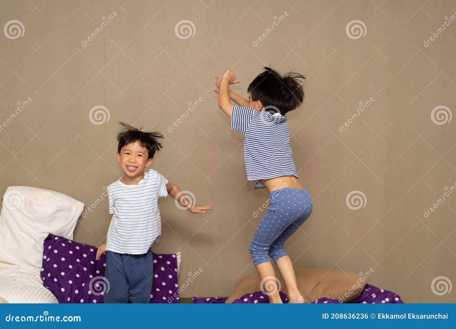 The Brothers are Jumping on the Bed Stock Photo - Image of awake, enjoy ...