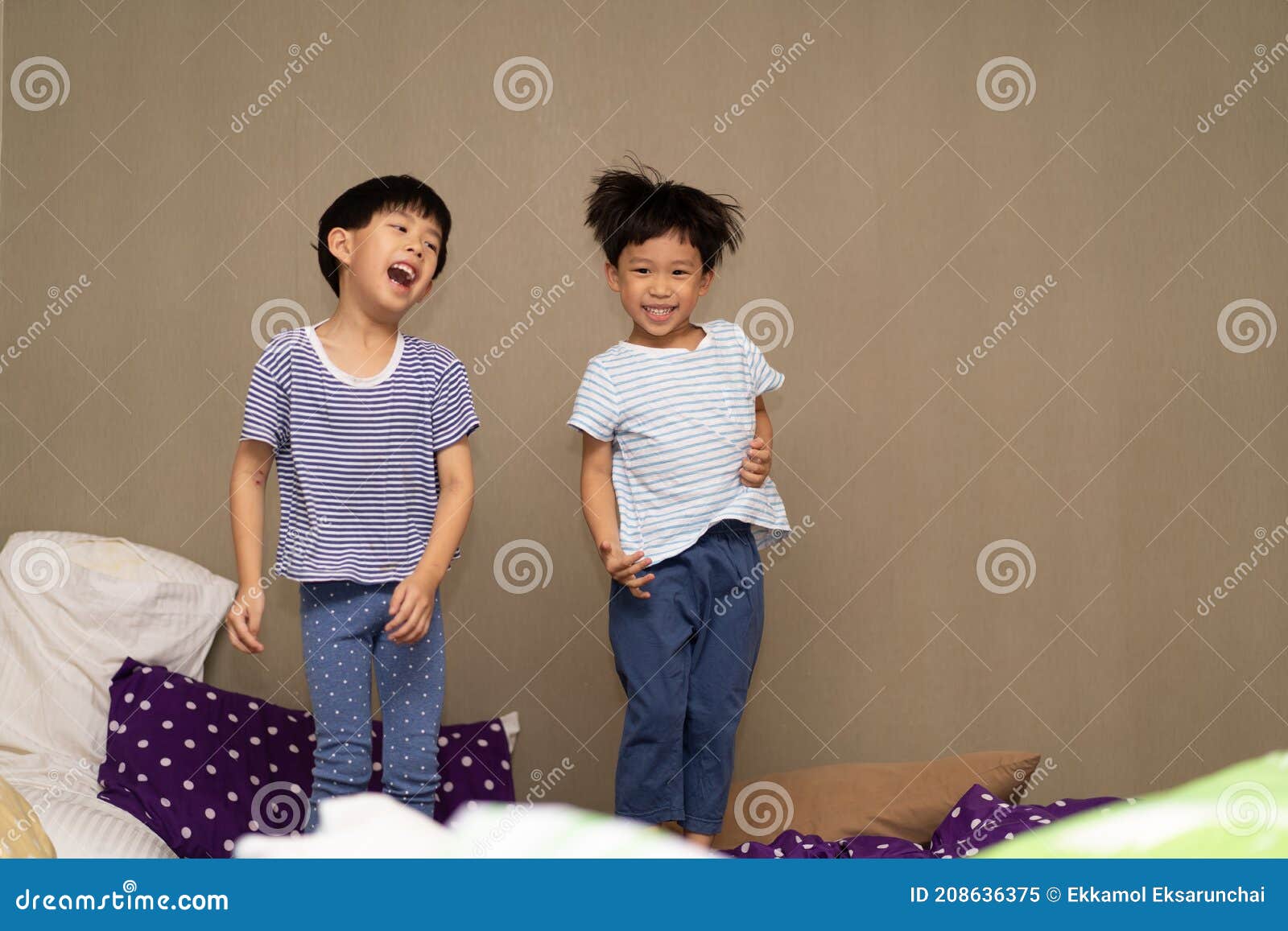The Brothers are Jumping on the Bed Stock Image - Image of cheerful ...