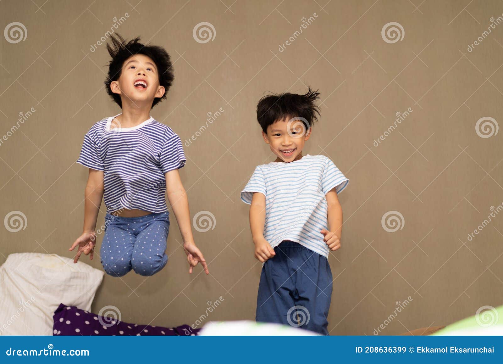 The Brothers are Jumping on the Bed Stock Image - Image of brother ...
