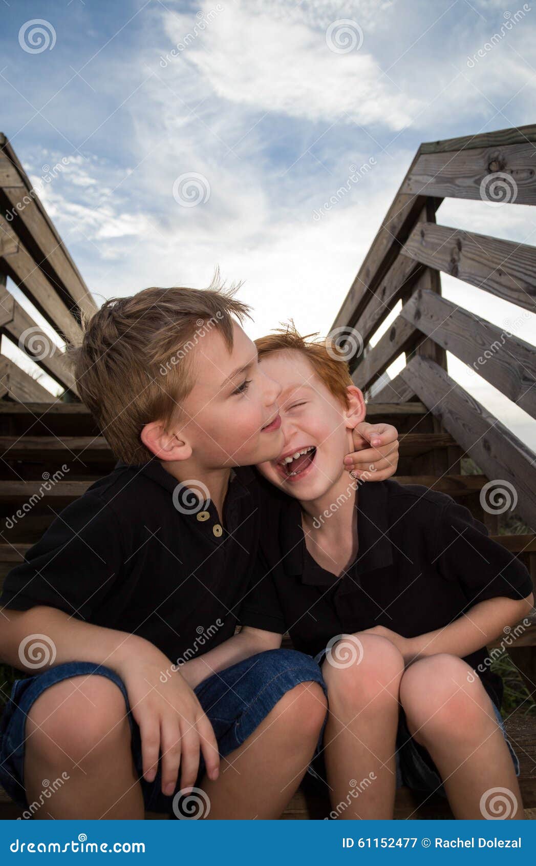 Brothers laughing on steps stock image. Image of sitting - 61152477