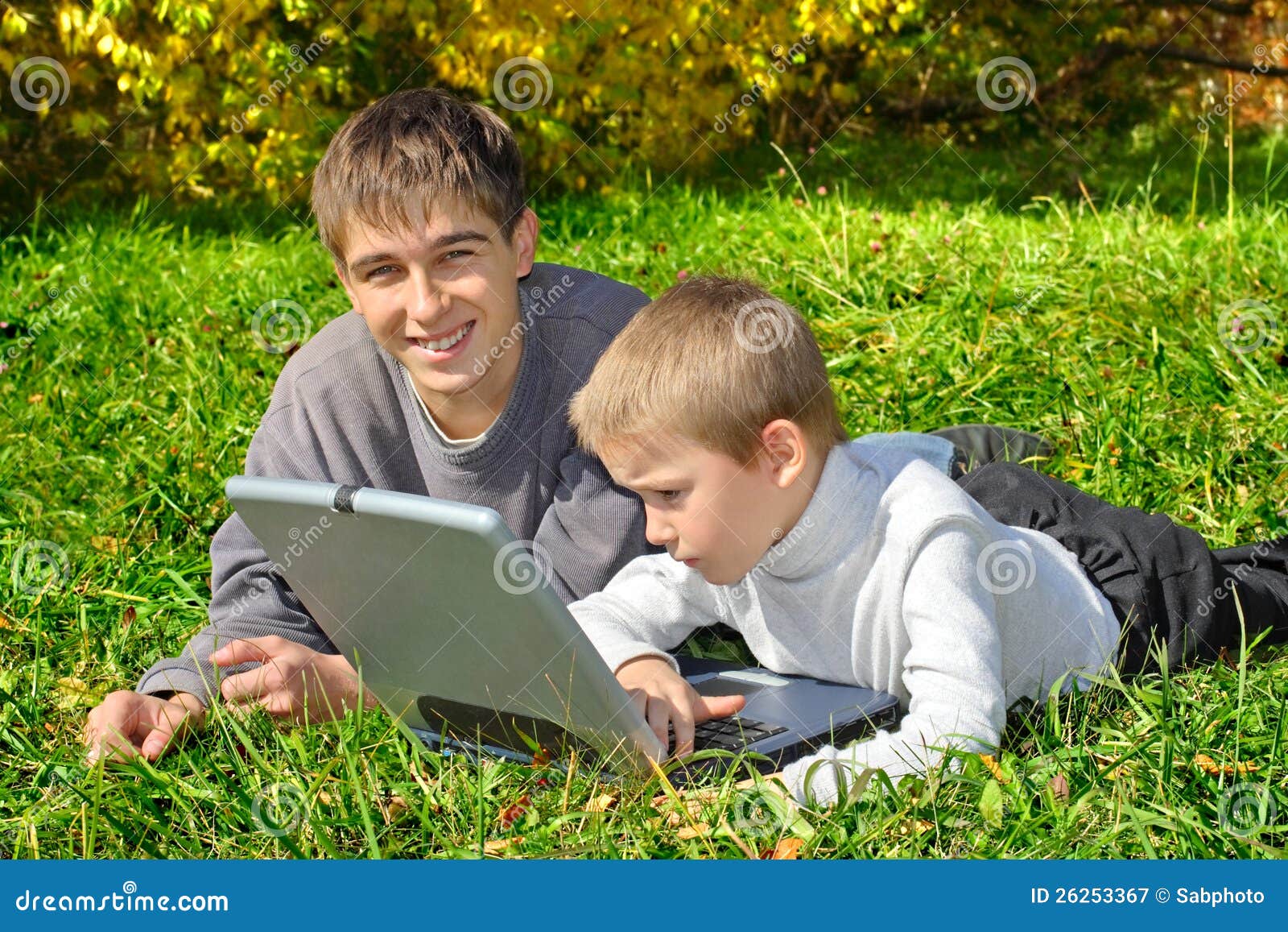 Brothers with notebook stock image. Image of brother - 26253367