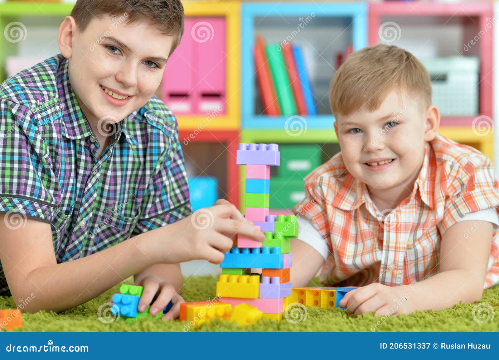 Brothers Playing with Colorful Plastic Blocks in Room Stock Image ...