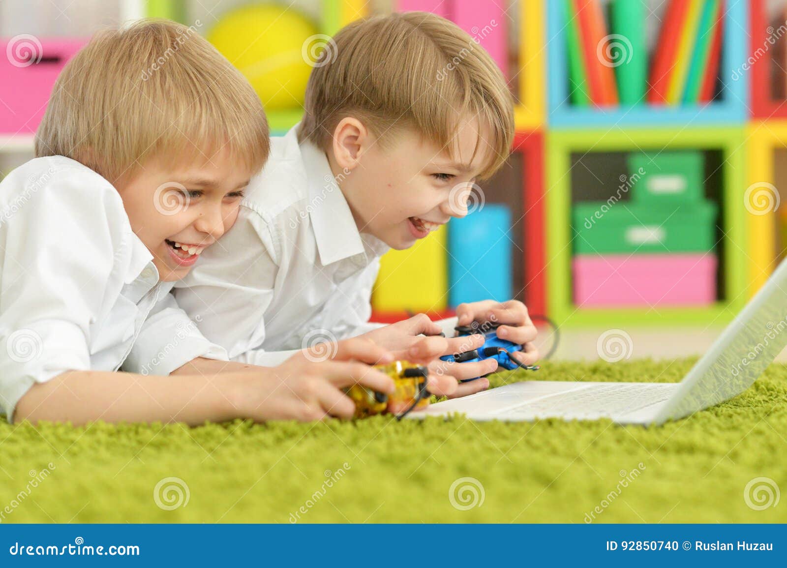 Brothers Playing a Computer Game Stock Photo - Image of cheerful, happy ...