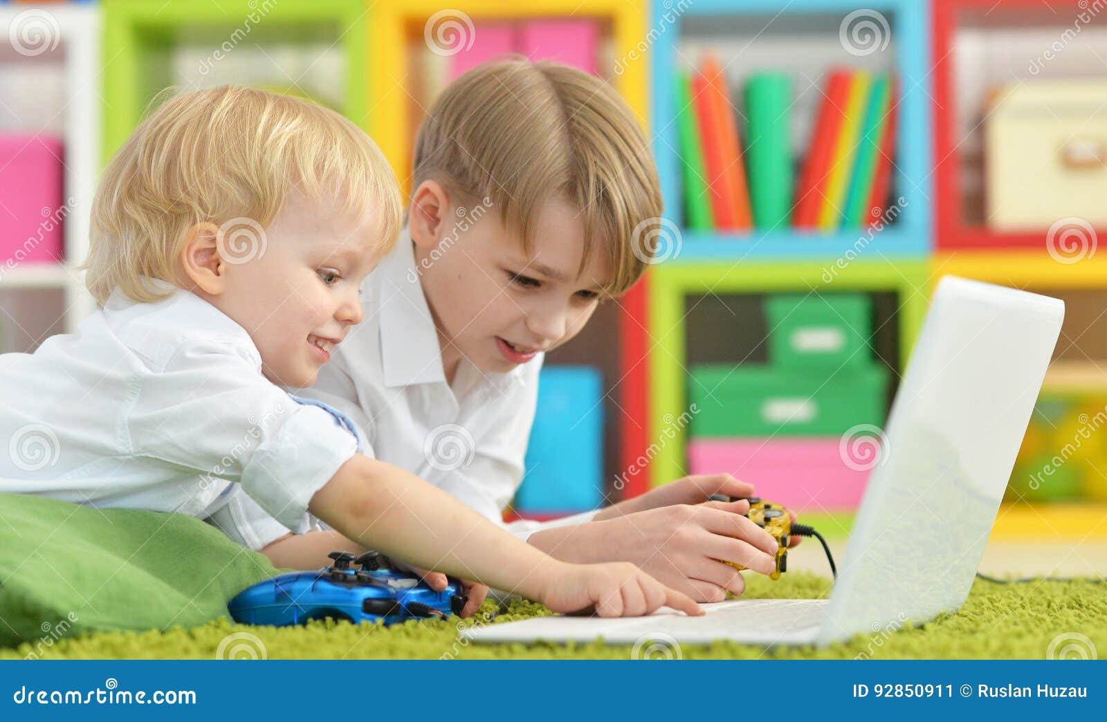 Brothers Playing a Computer Game Stock Image - Image of playing, games ...