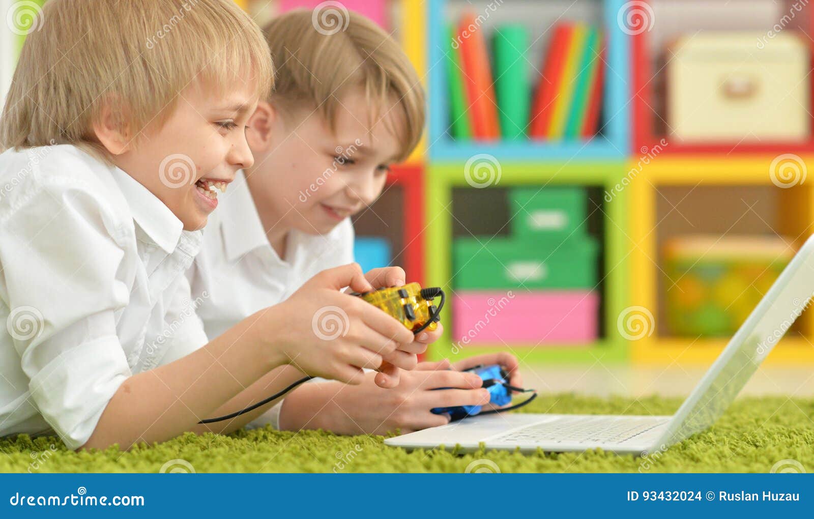 Brothers Playing a Computer Game Stock Photo - Image of school, smiling ...