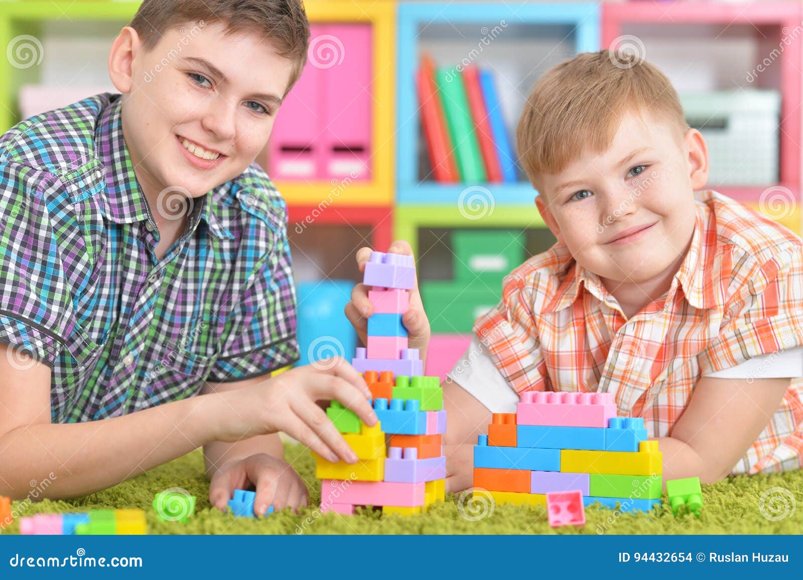 Brothers playing in room stock photo. Image of friendship - 94432654