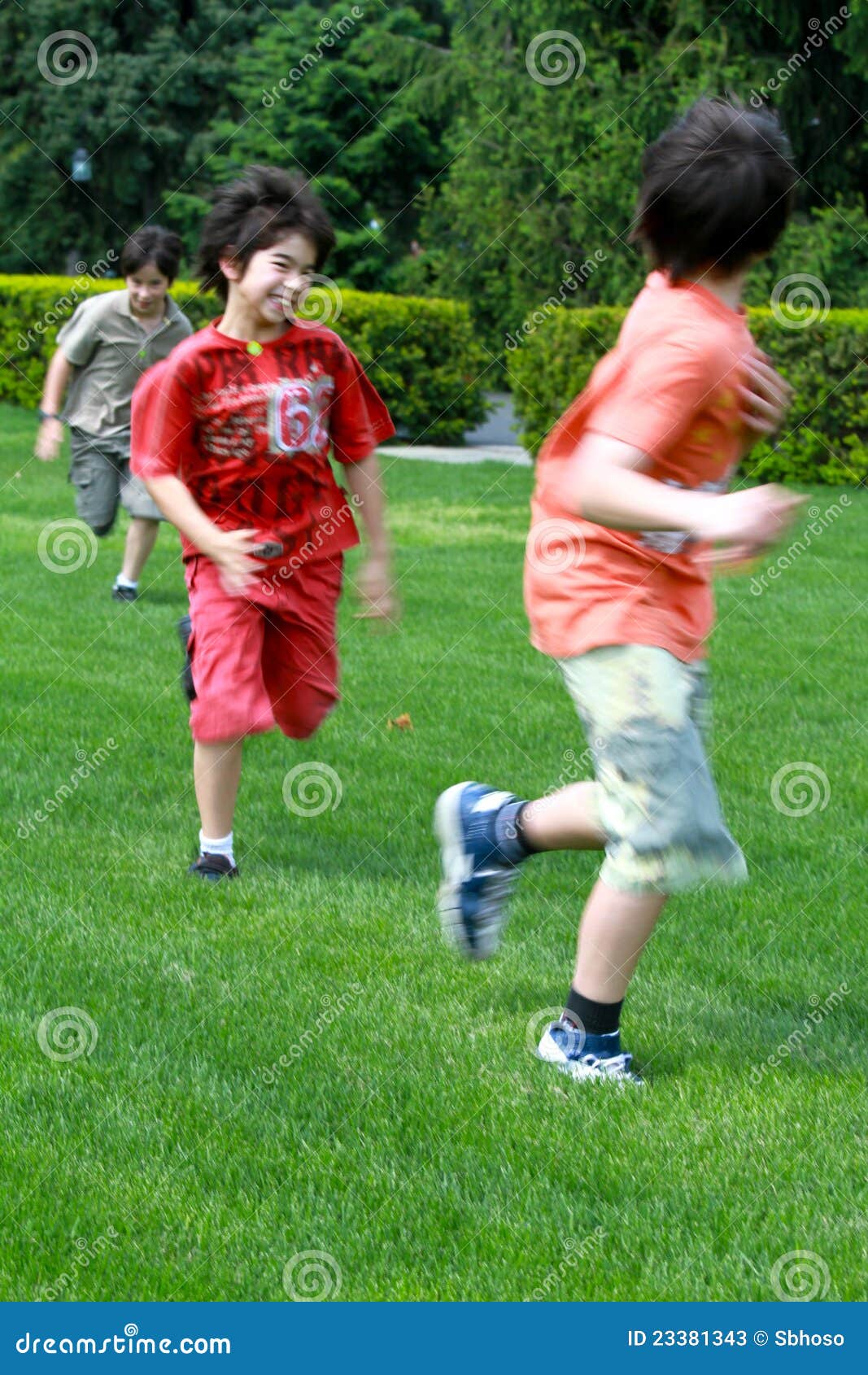 Brothers Playing Tag at the Park Stock Image - Image of competing ...