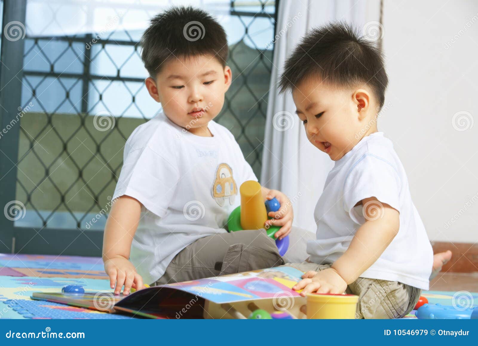 Brothers playing together stock image. Image of chinese - 10546979