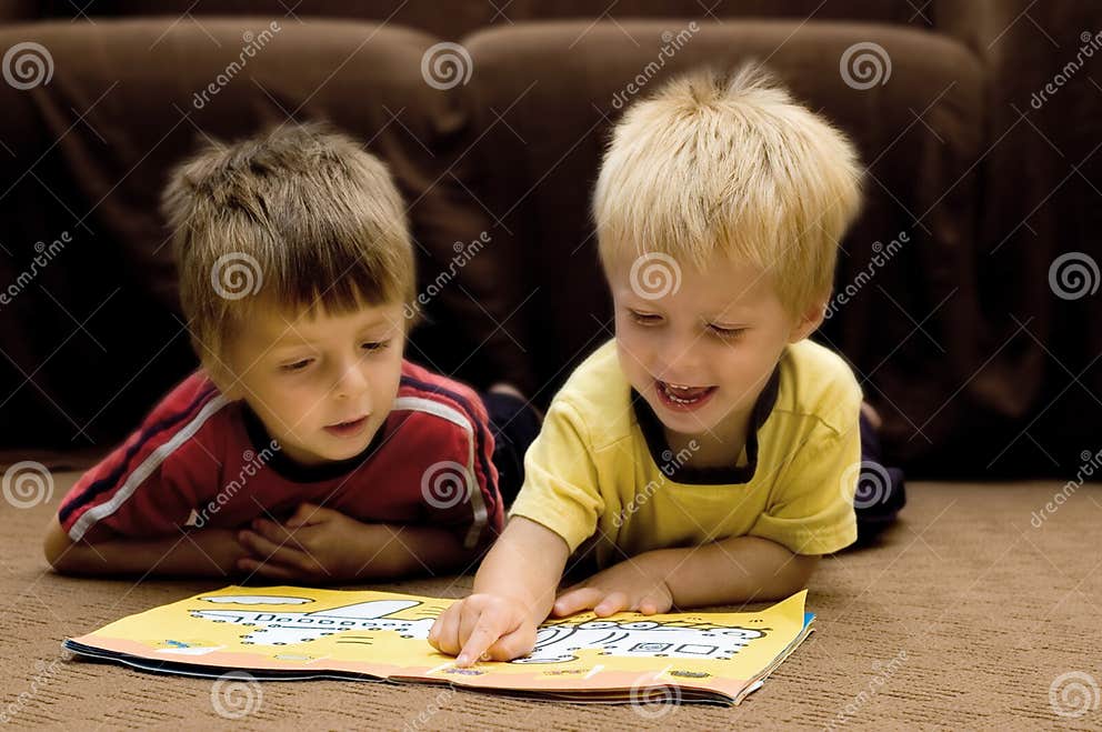 Brothers reading together stock photo. Image of sibling - 5955796
