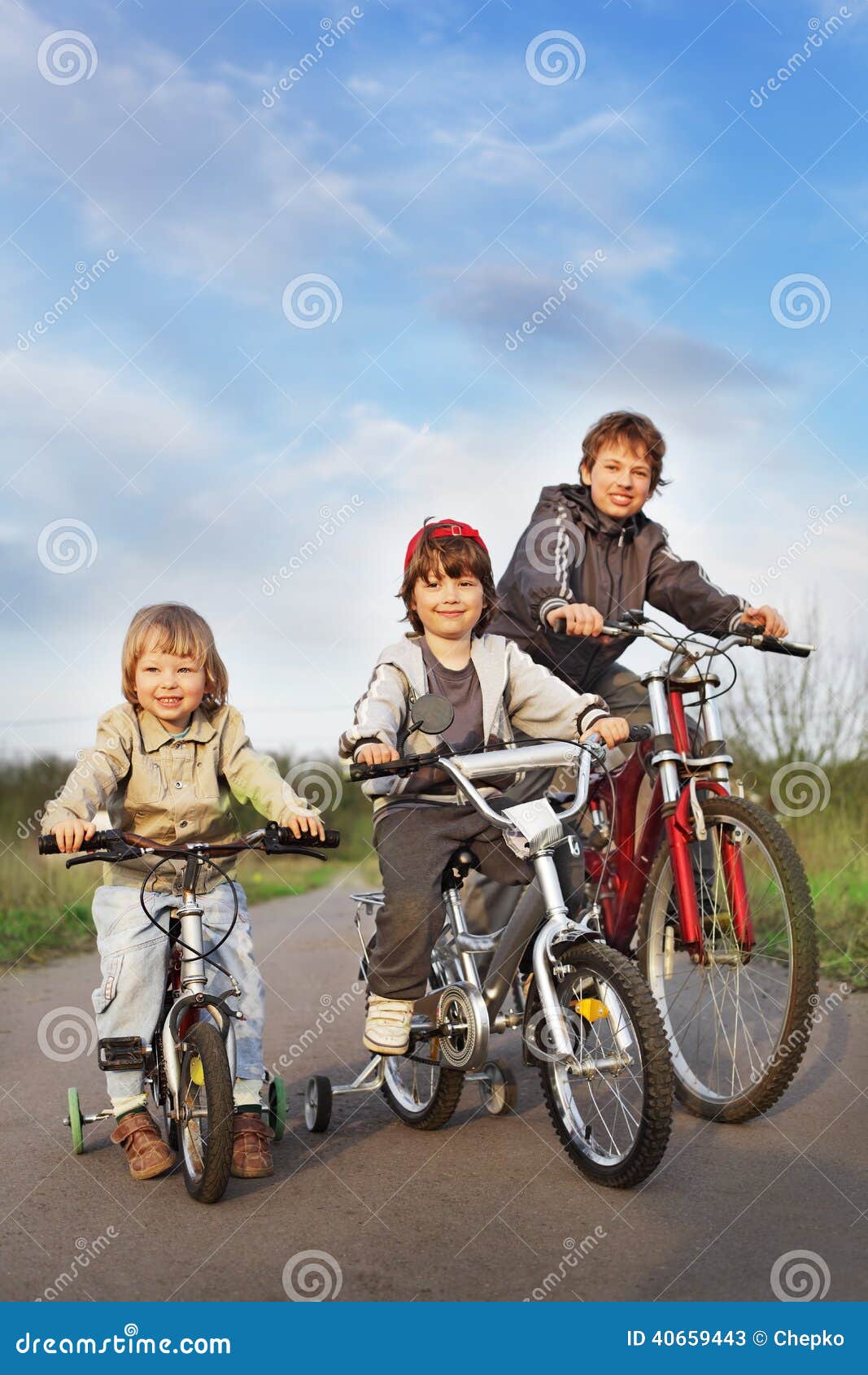Brothers ride on bikes stock image. Image of brothers - 40659443