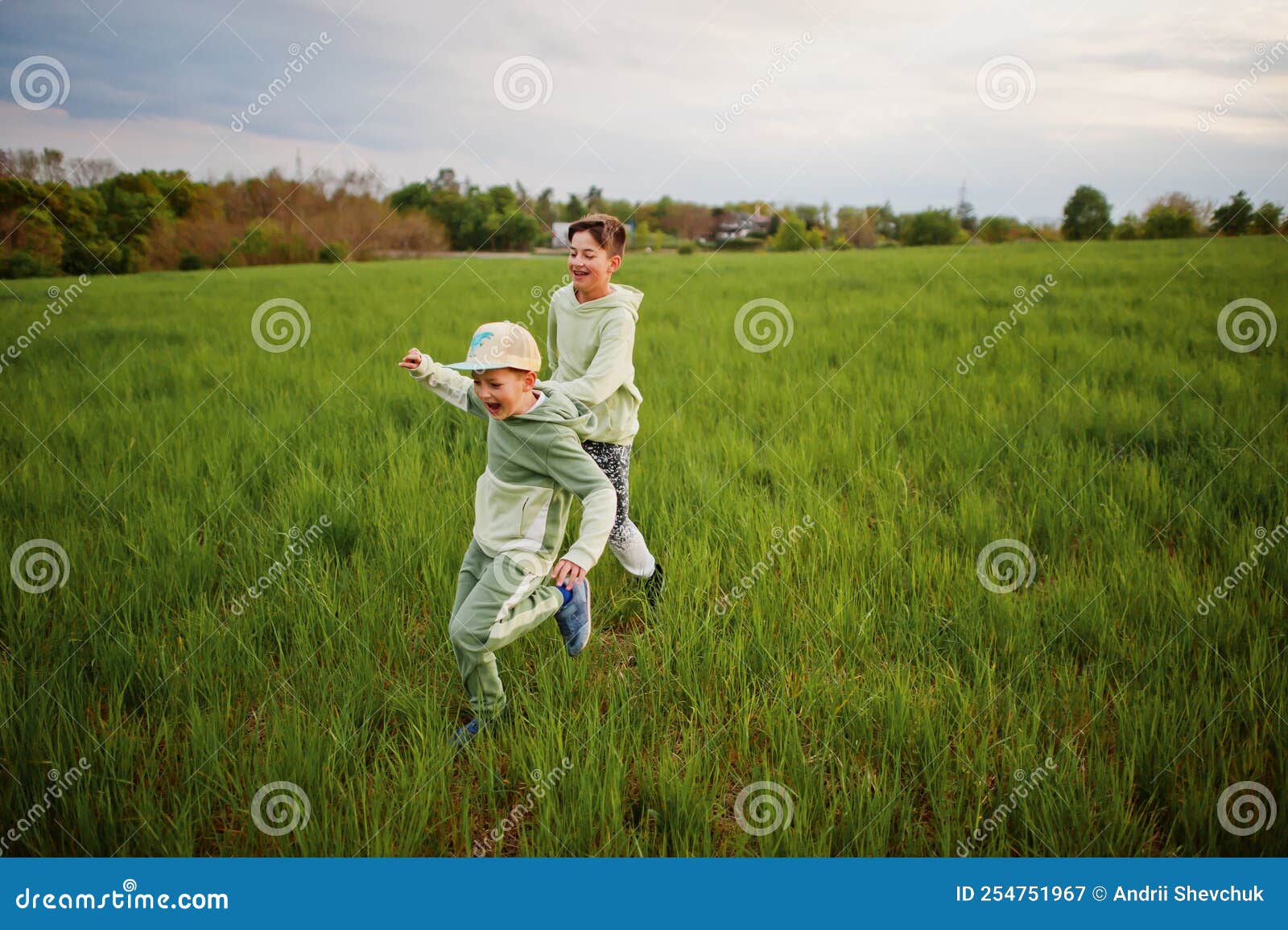 Brothers Running and Having Fun Together at Meadow Stock Image - Image ...