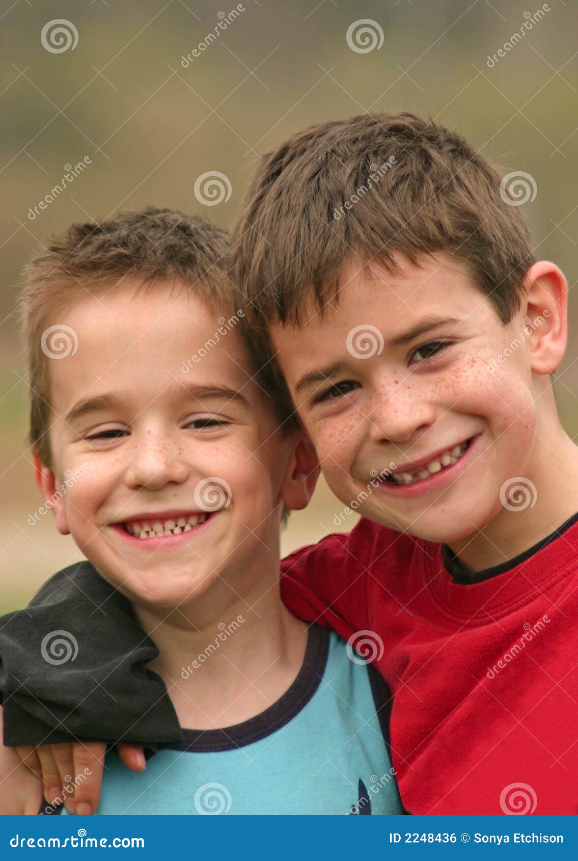 Two Brothers Smiling And Sitting Together On White Royalty-Free Stock ...