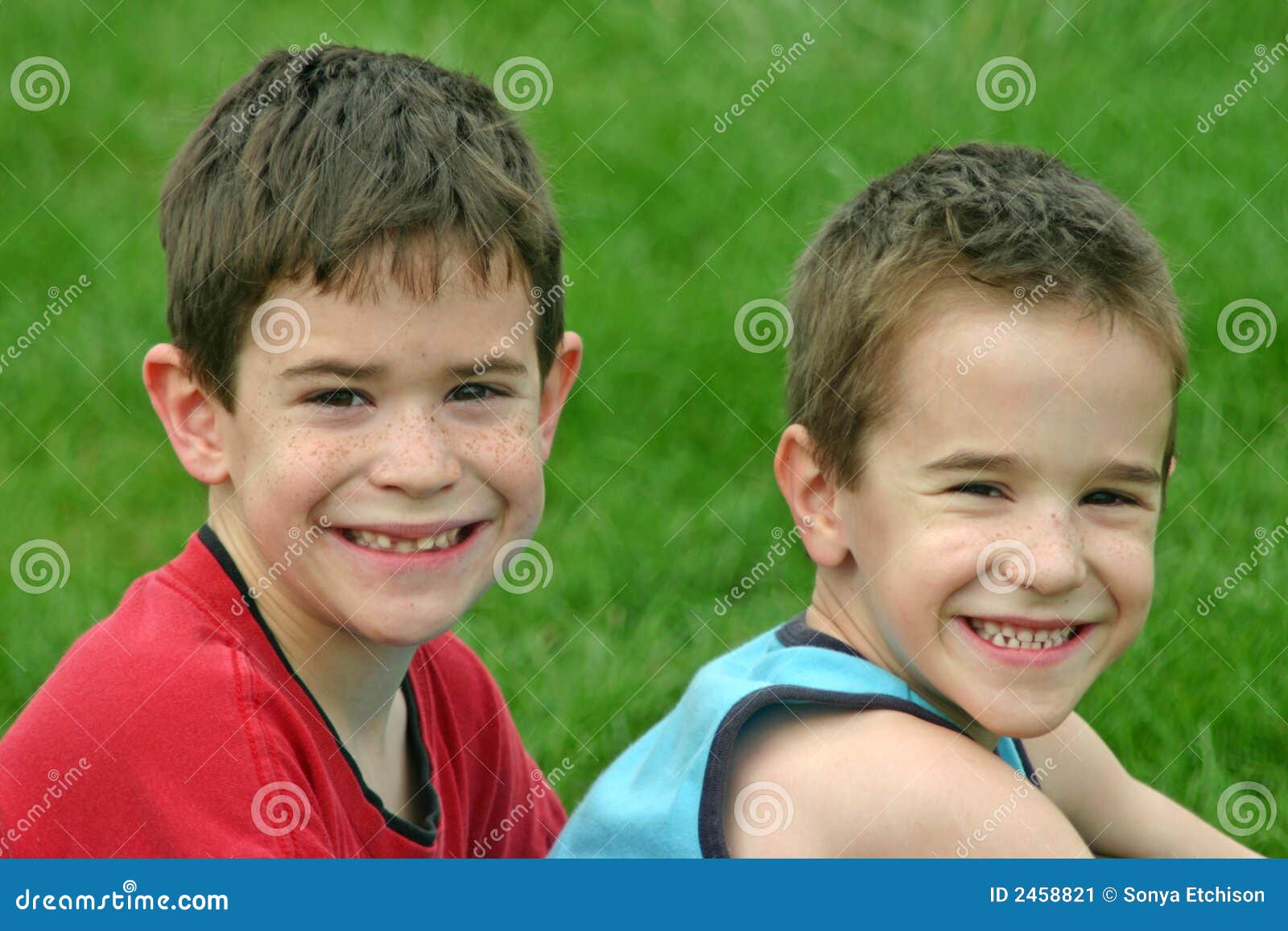 Two Brothers Smiling And Sitting Together On White Royalty-Free Stock ...