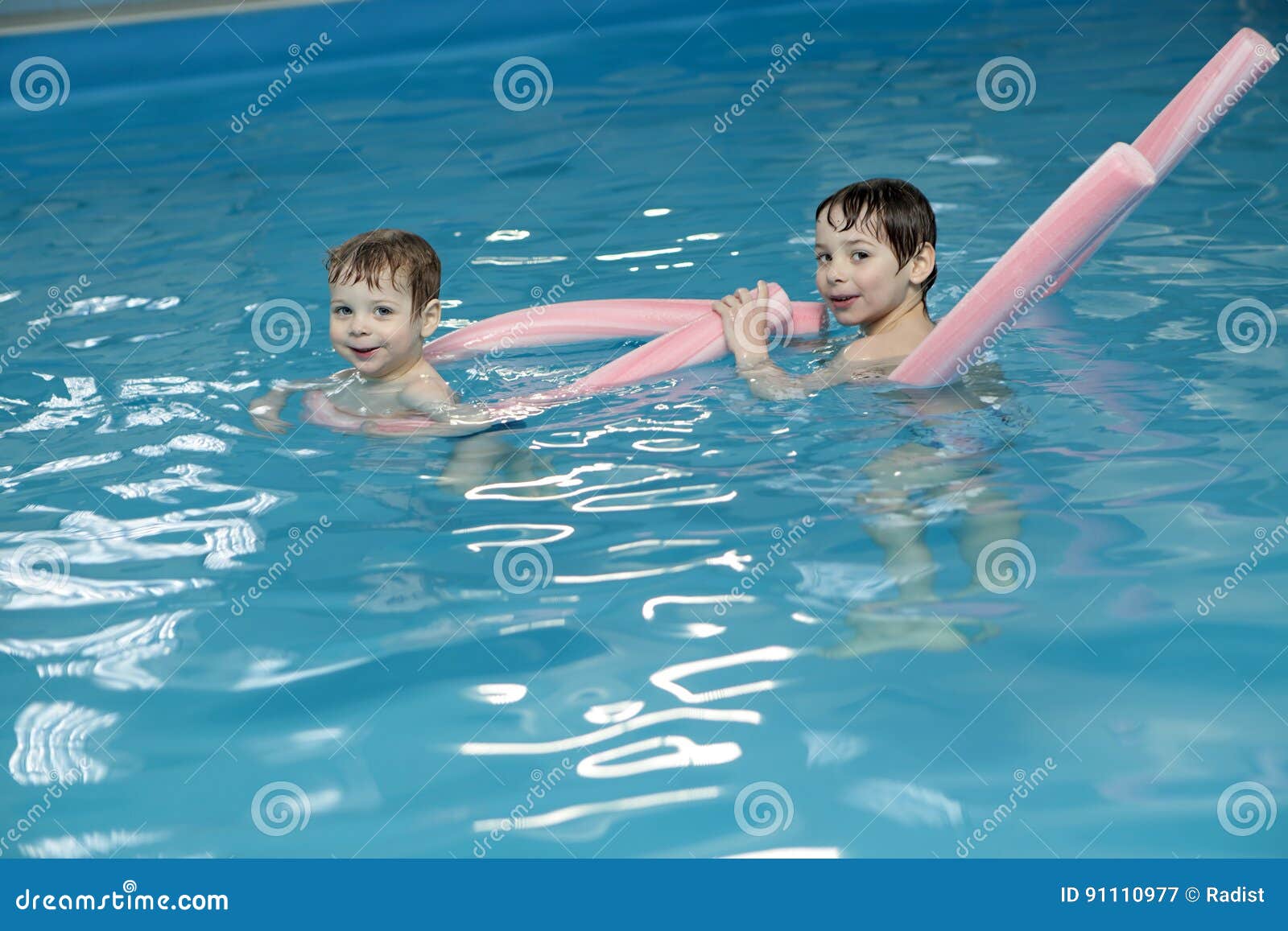 Brothers in swimming pool stock image. Image of expression - 91110977
