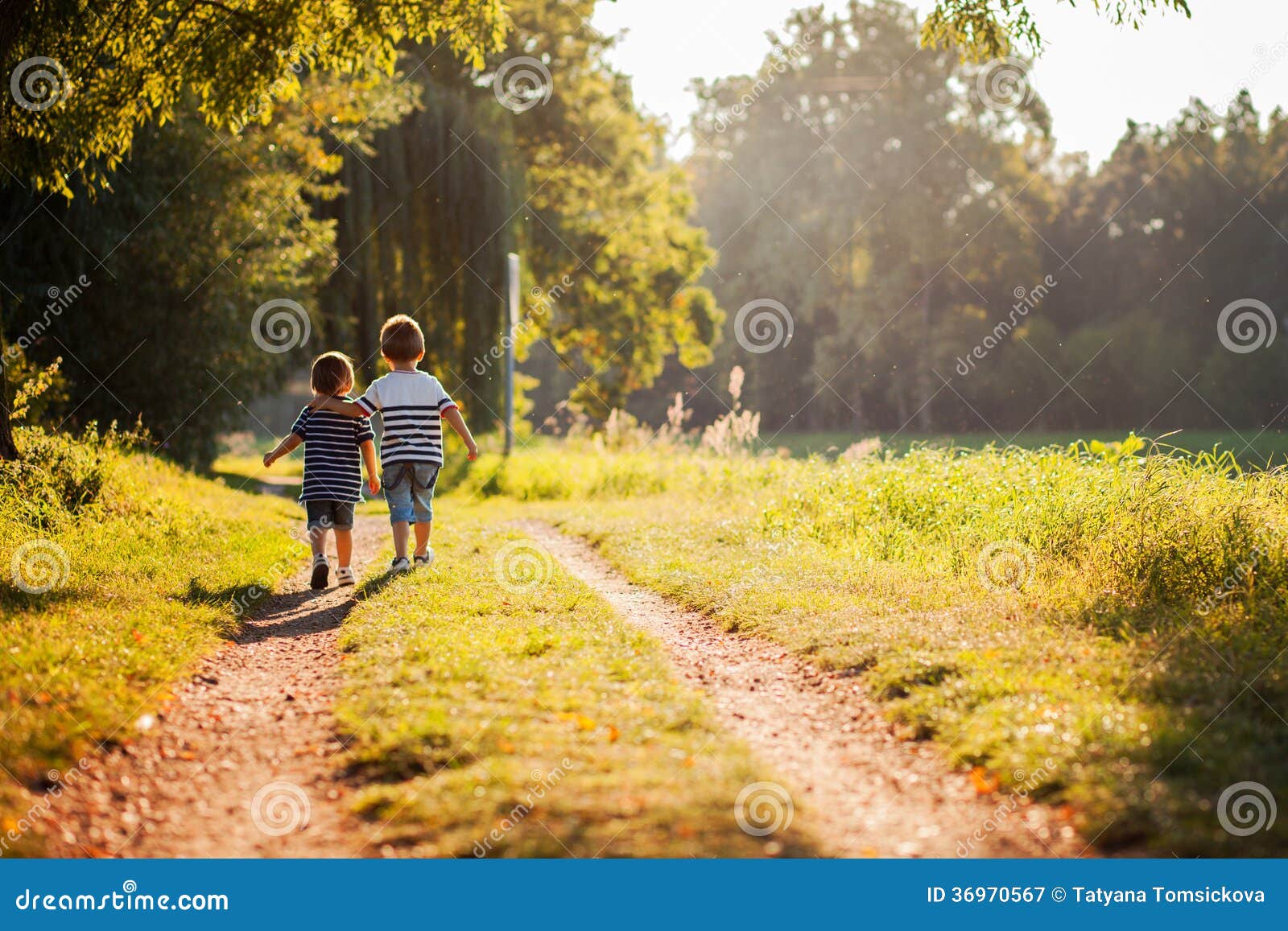 Brothers walking in a park stock image. Image of path - 36970567