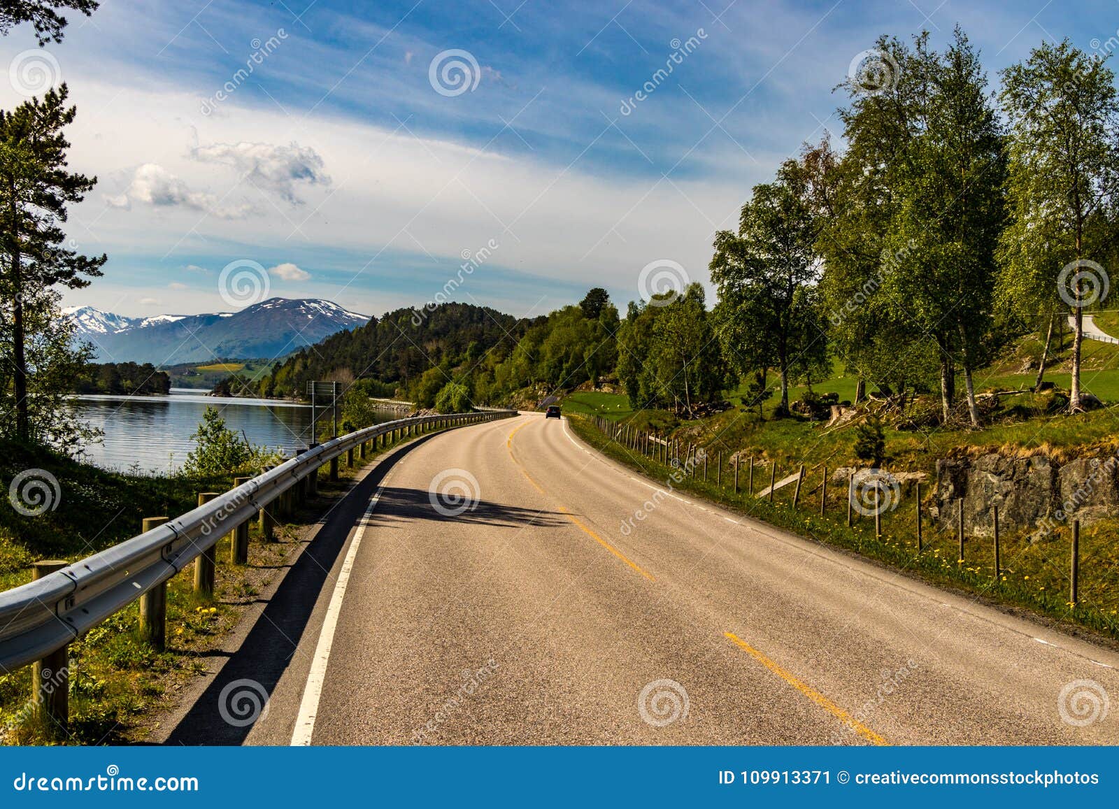 Brown Asphalt Road Beside Lake Picture. Image: 109913371