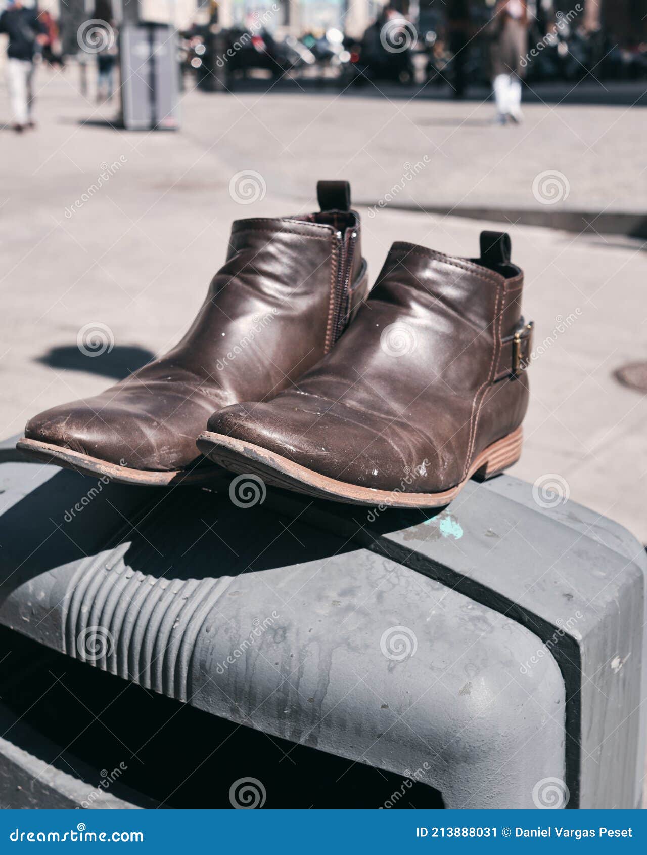 Brown Boots Abandoned on an Urban Trash Can Stock Image - Image of ...