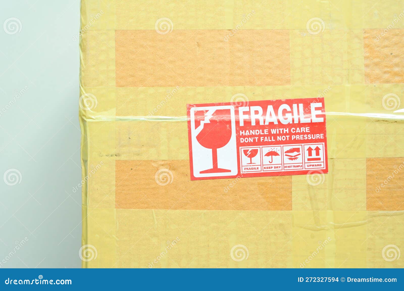 Brown Box Packaging with Warning Symbol Stock Photo - Image of ...