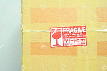 Brown Box Packaging with Warning Symbol Stock Photo - Image of ...