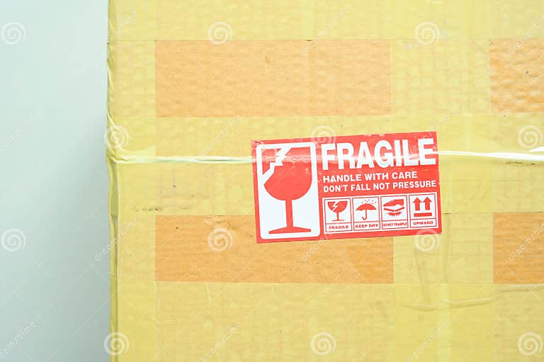 Brown Box Packaging with Warning Symbol Stock Photo - Image of ...