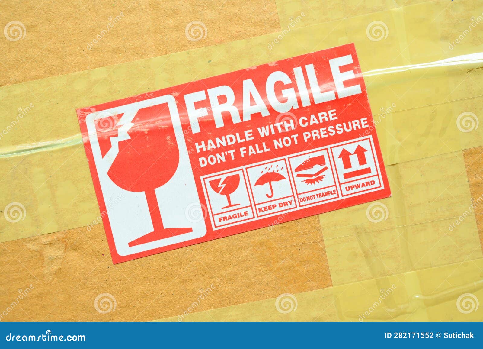 Brown Box Packaging with Warning Symbol Stock Photo - Image of postage ...