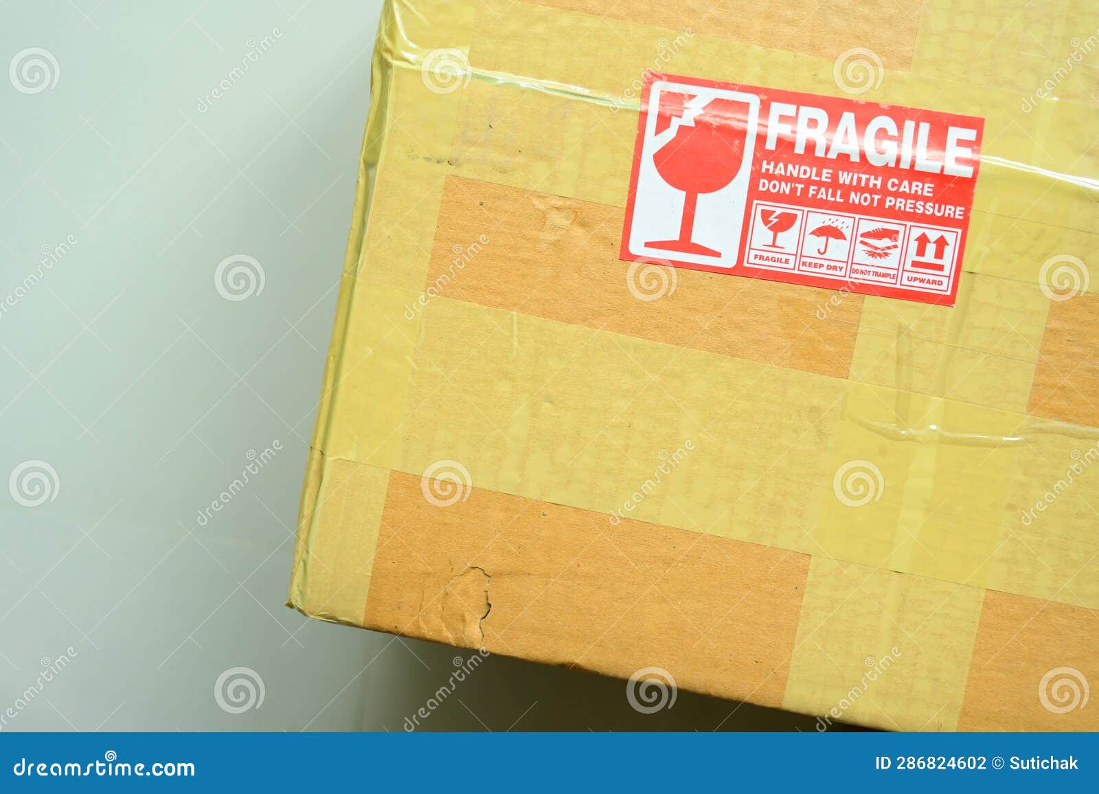 Brown Box Packaging with Warning Symbol Stock Photo - Image of cover ...