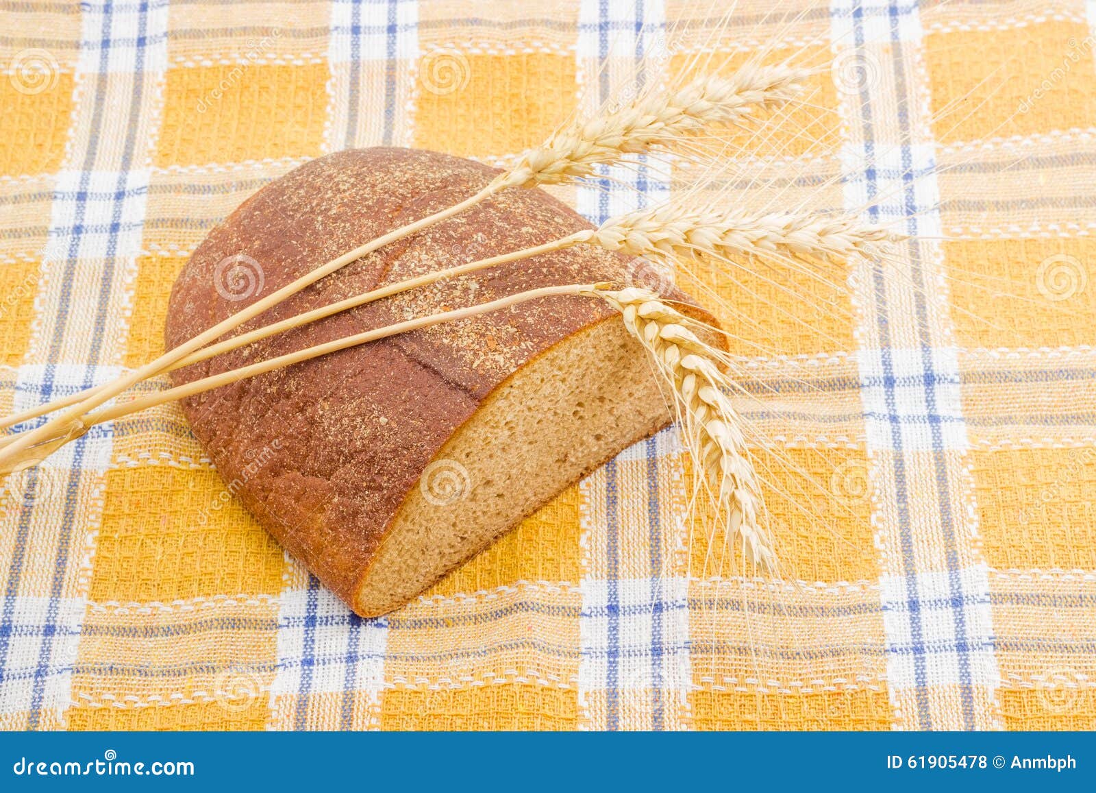 Brown Bread and Three Spikes on a Checkered Tablecloth. Stock Photo ...