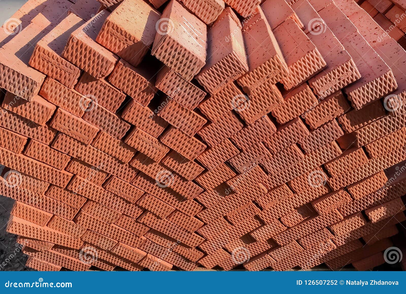 Brown Bricks Folded into a Pile, a Background from Bricks. Stock Photo ...