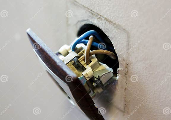 Brown Broken Electrical Socket Fell Out of the Wall. Stock Photo ...