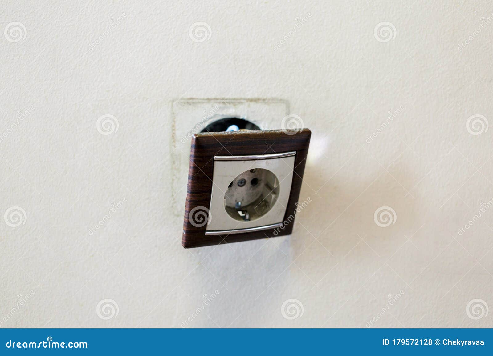 Brown Broken Electrical Socket Fell Out Of The Wall. The Socket Is Torn ...