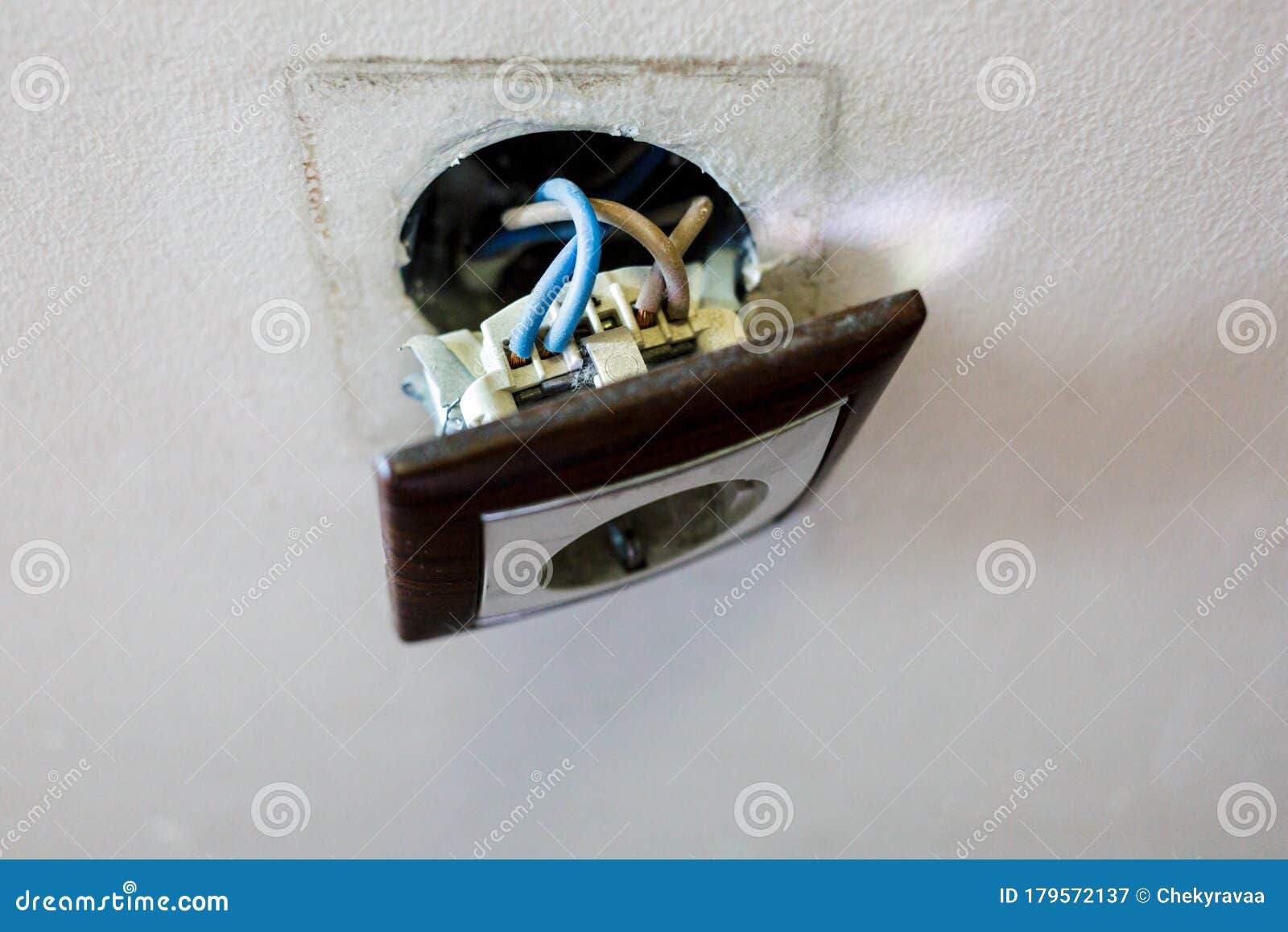 Brown Broken Electrical Socket Fell Out Of The Wall. The Socket Is Torn ...