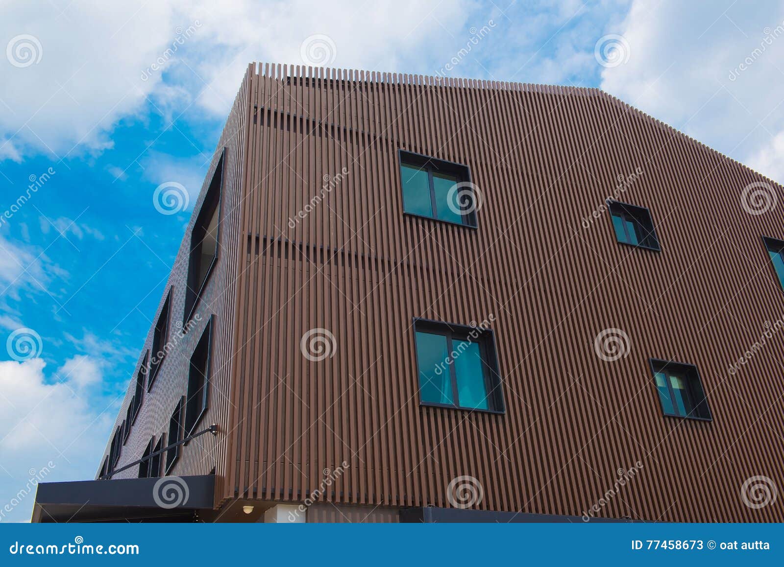 Brown Building with Windows and Blue Sky on Background Stock Image ...
